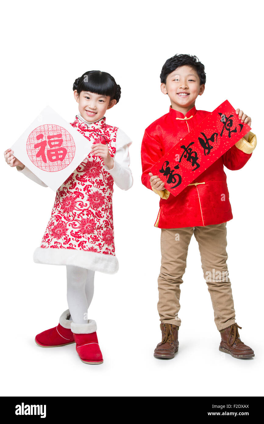 Cute children celebrating Chinese new year Stock Photo - Alamy