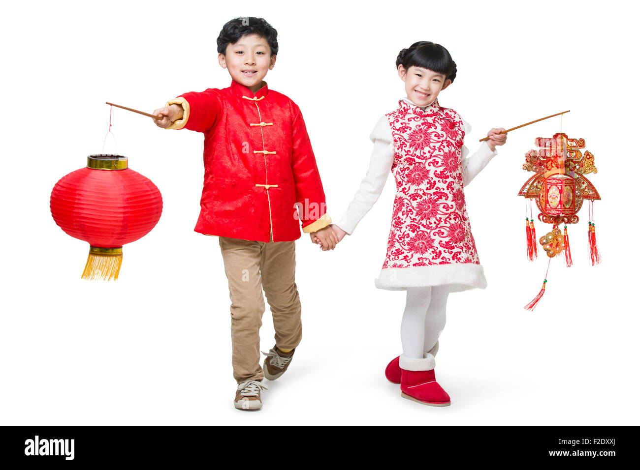 Happy children celebrating Chinese new year with traditional lanterns ...