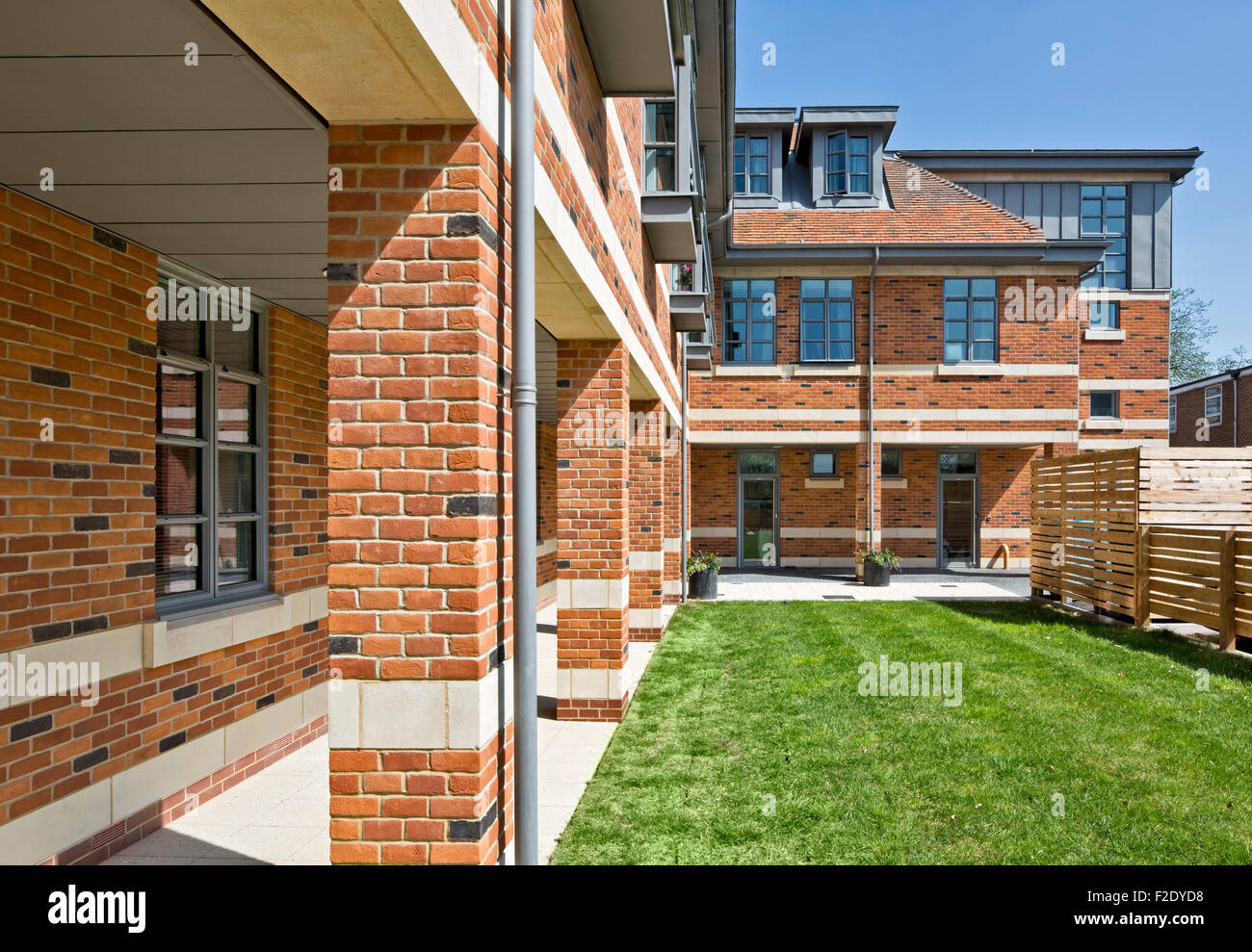 Perspective along brick colonnade with garden. Felsted School Boarding ...