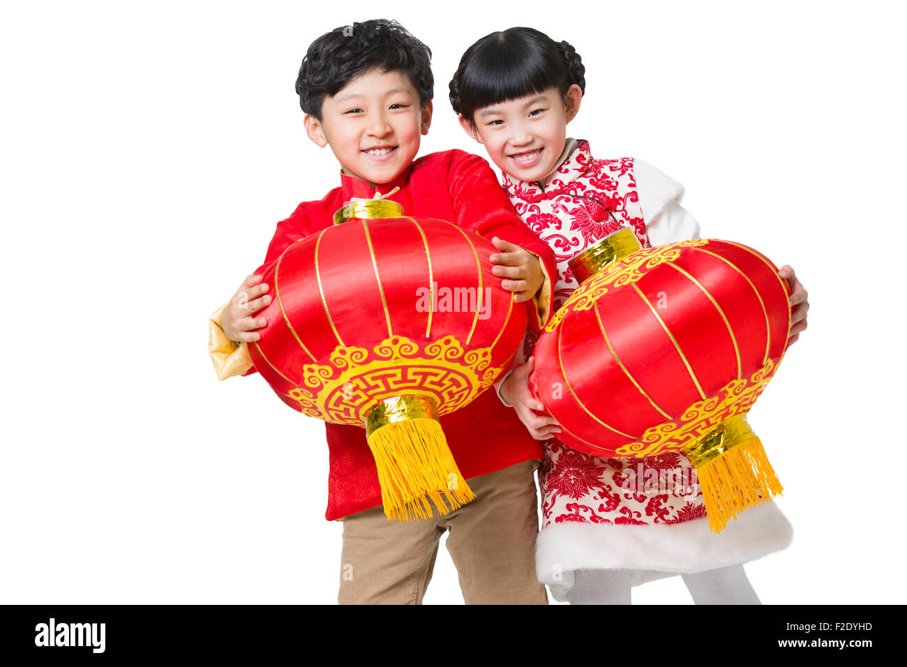 Happy children celebrating Chinese new year with traditional lanterns ...