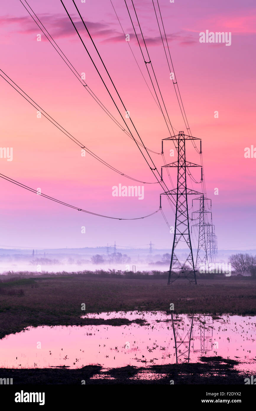 Power transmission lines cross the countryside Stock Photo - Alamy