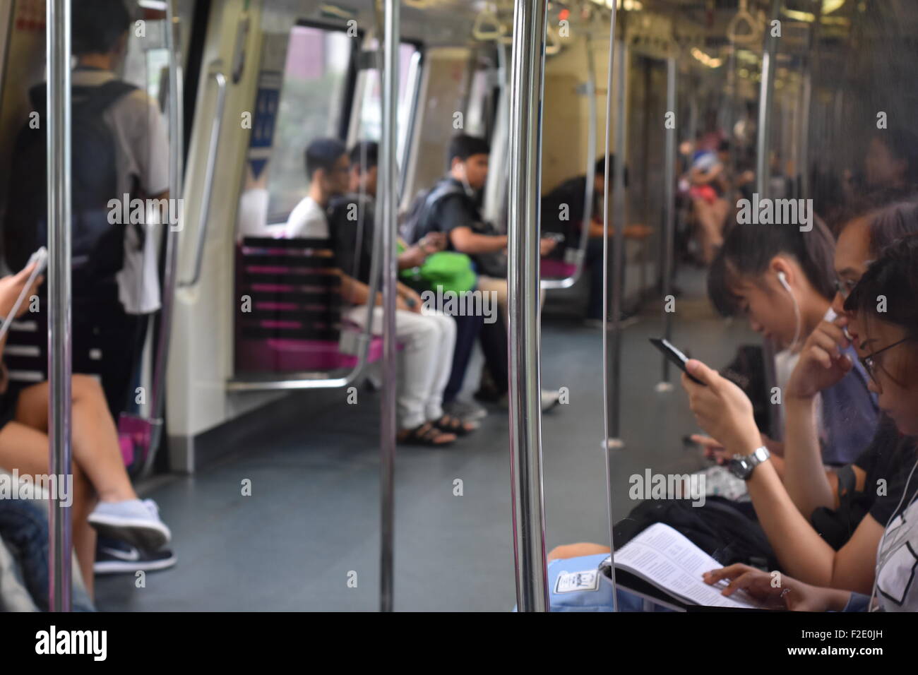 Commuters in the public transport Stock Photo - Alamy