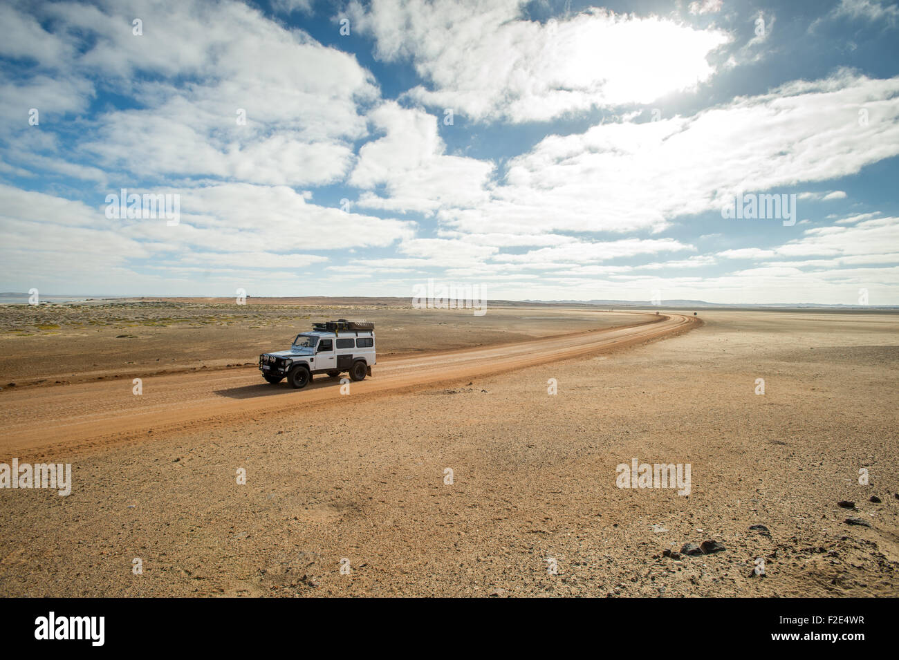 Land Rover Defender 110 driving on the road in Namibia, Africa Stock ...