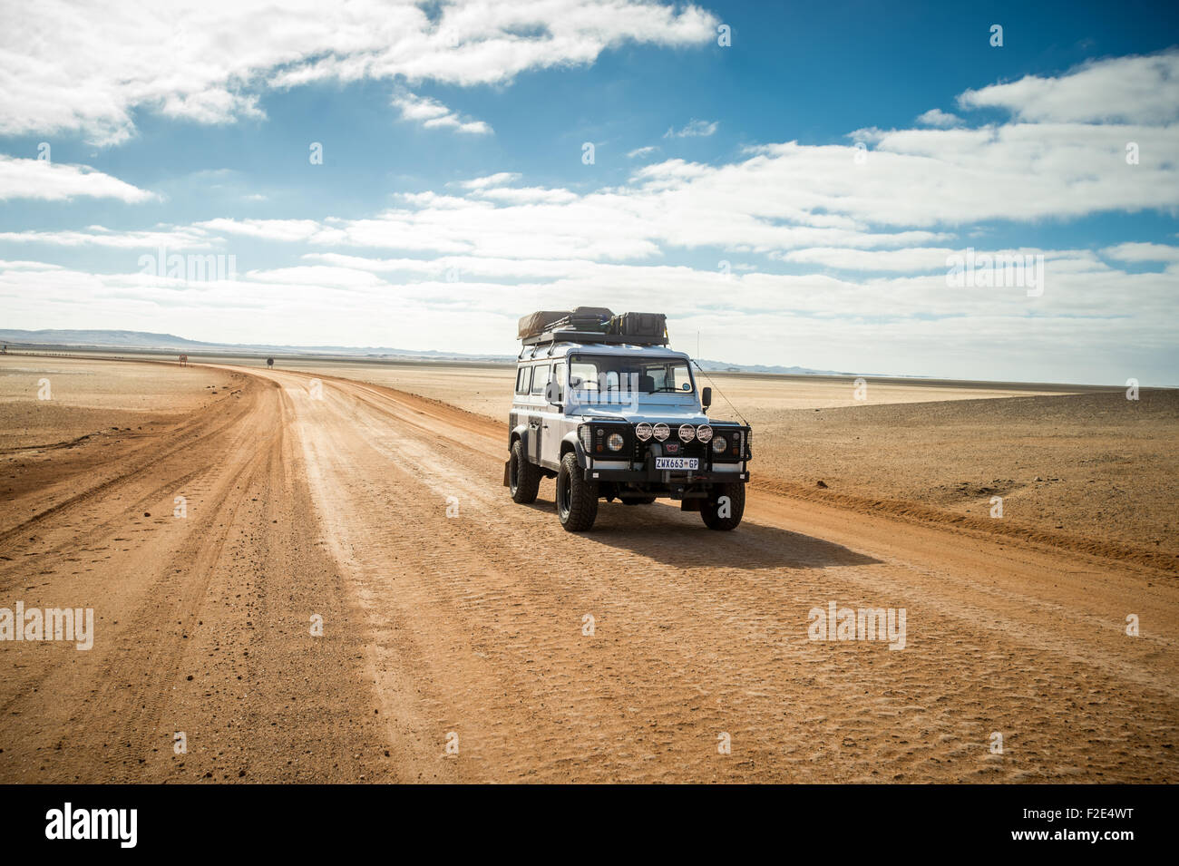 Land Rover Defender 110 driving on the road in Namibia, Africa Stock ...
