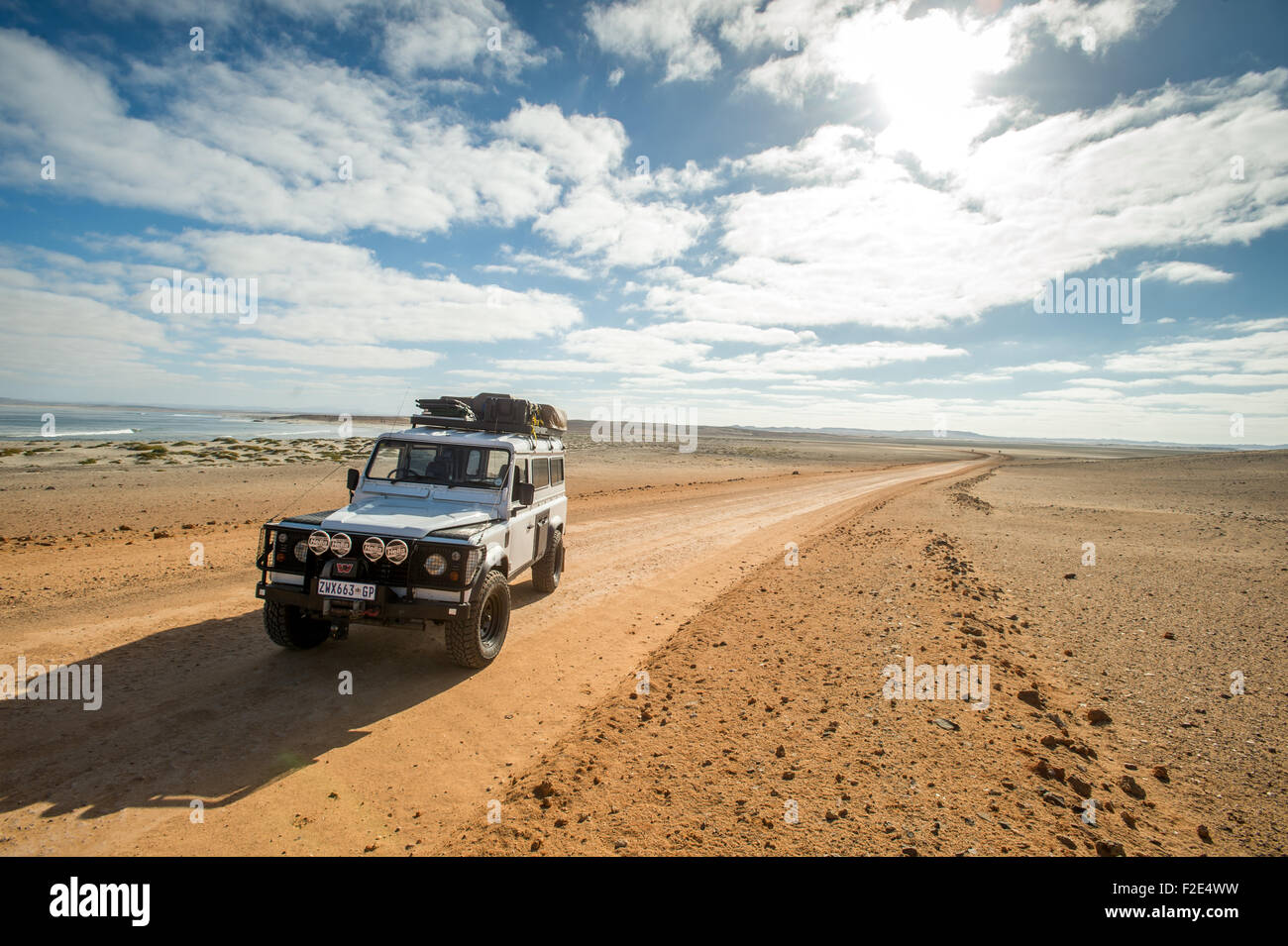 Land Rover Defender 110 driving on the road in Namibia, Africa Stock ...