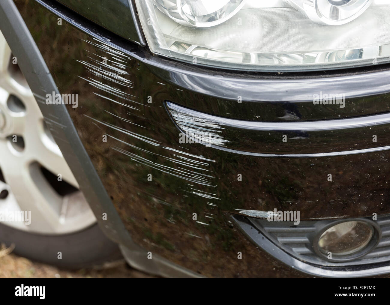 Black bumper car scratched with deep damage to the paint Stock Photo ...