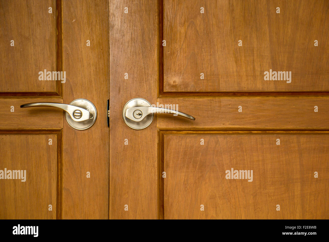 Door knob and keyhole made of brass On the old wooden door Stock Photo ...