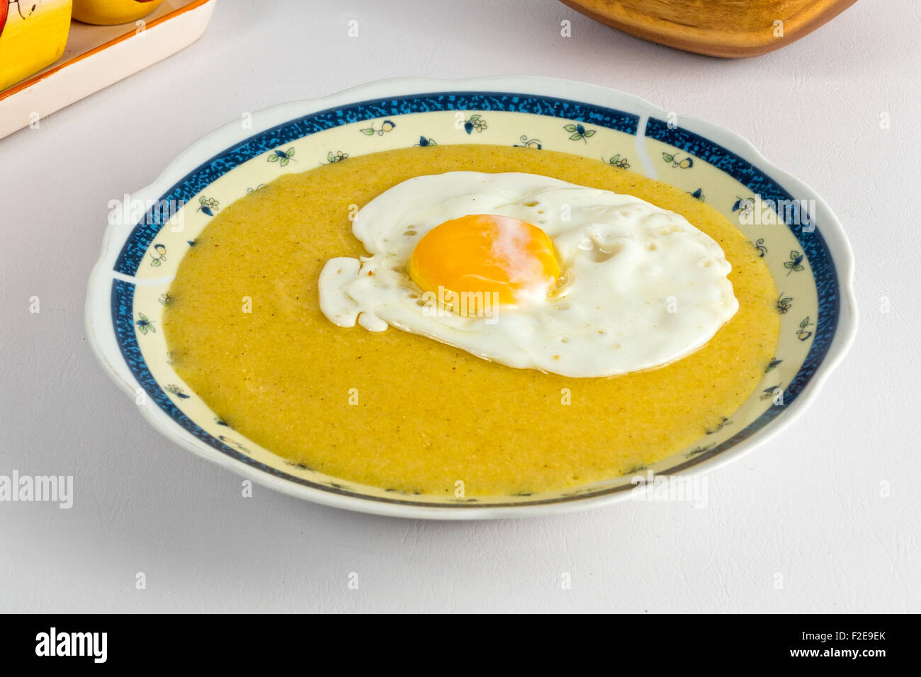 Cornmeal dish with a fried egg Stock Photo - Alamy