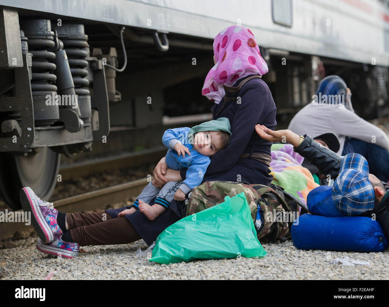 Dugo Selo, Croatia. 17th Sep, 2015. Refugees wait for buses at the ...