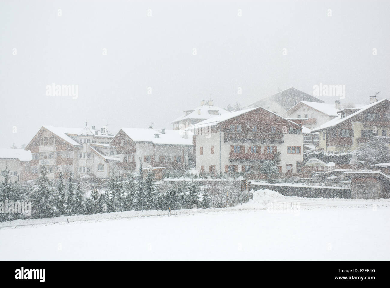 Chalets, during a snowstorm, in Mals, Northern Italy Stock Photo - Alamy