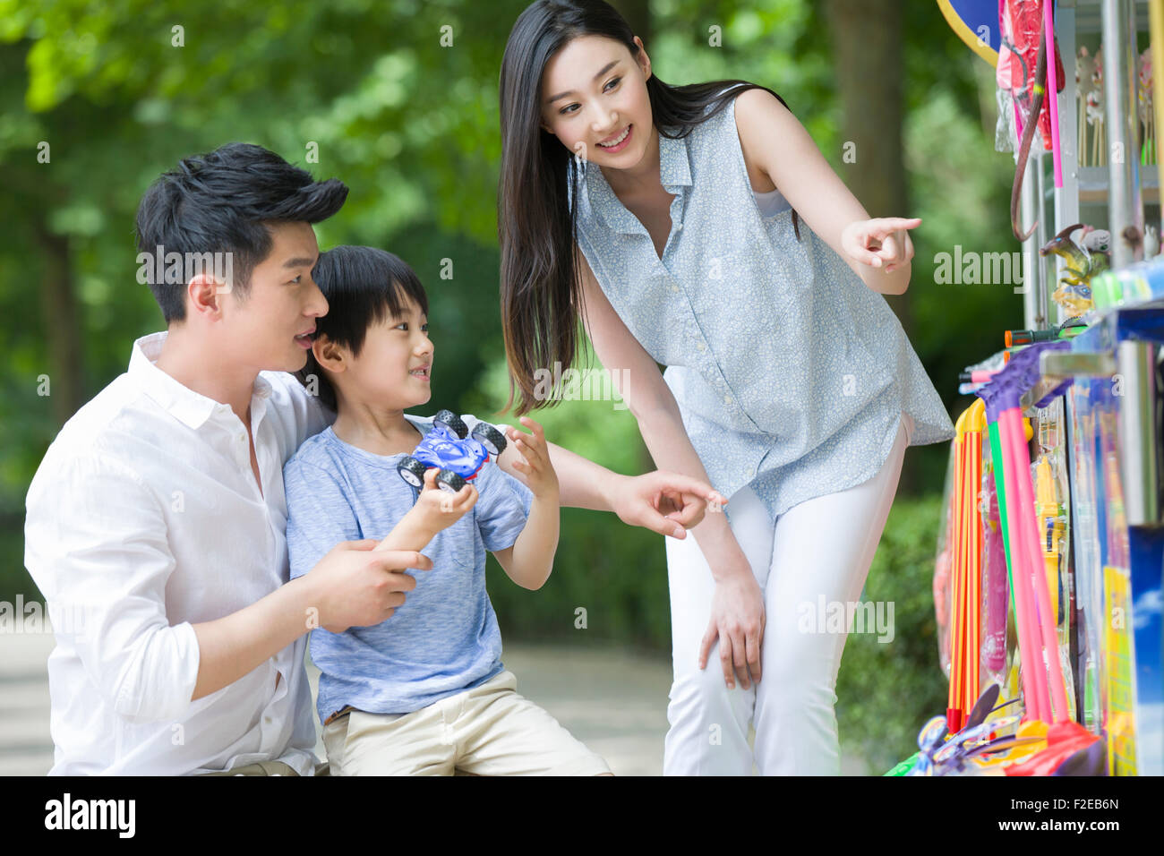 Child holding toy money hi-res stock photography and images - Alamy