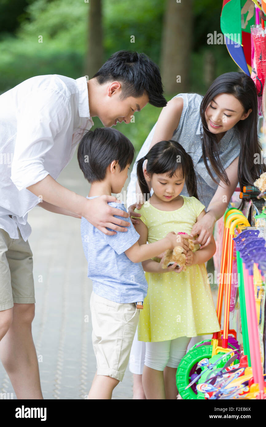 Parents and children buying toys Stock Photo - Alamy
