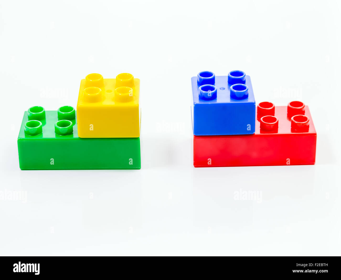 Colorful plastic building bricks on white background, disonnected ...