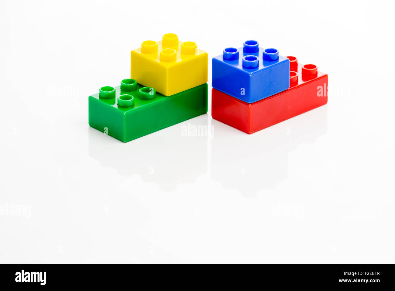 Colorful plastic building bricks on white background Stock Photo - Alamy
