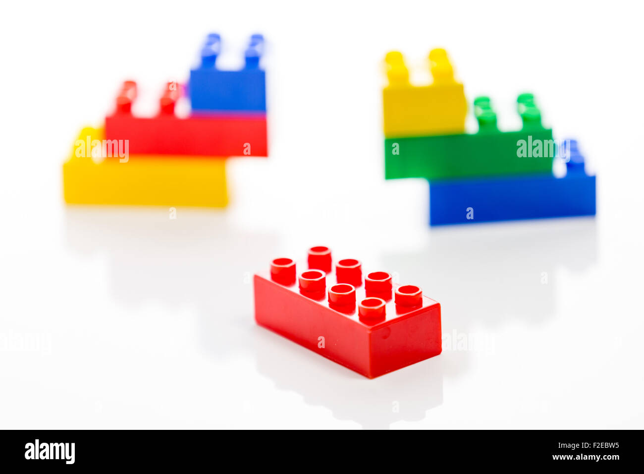 Colorful plastic building bricks on white background, missing link ...