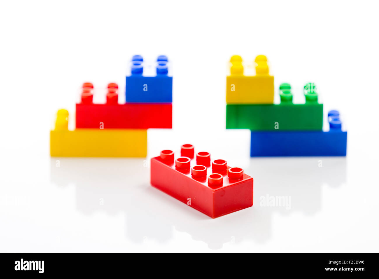 Colorful plastic building bricks on white background, missing link ...