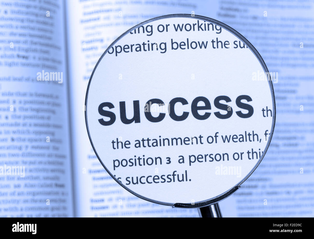 Success text highlighted through a magnifying glass Stock Photo - Alamy
