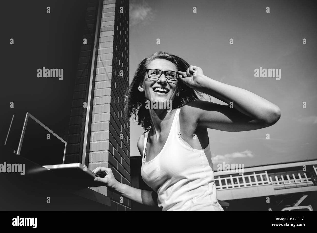 Portrait of female student outside library next to the brick wall Stock ...
