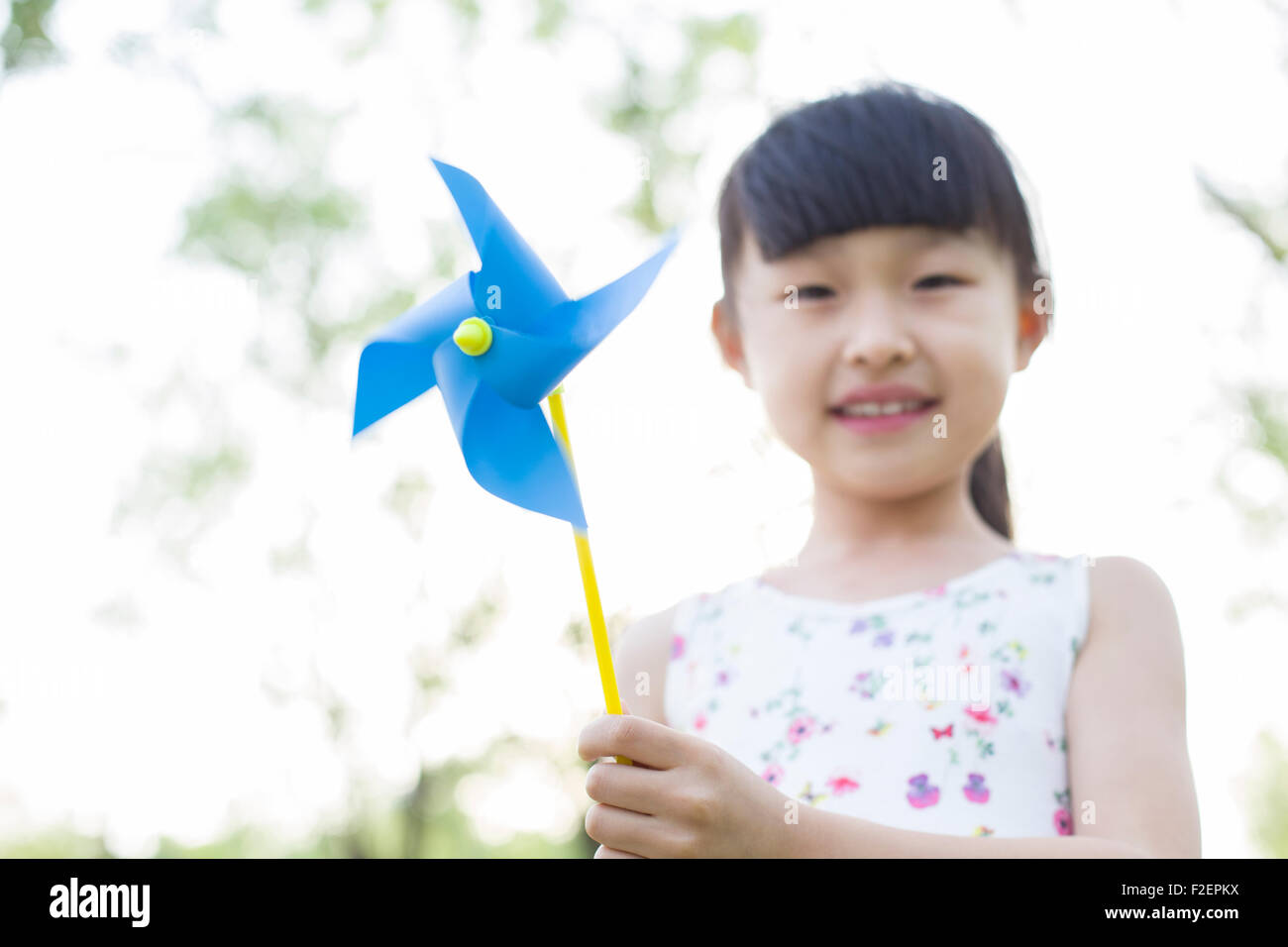 Girl with a pinwheel hi-res stock photography and images - Alamy