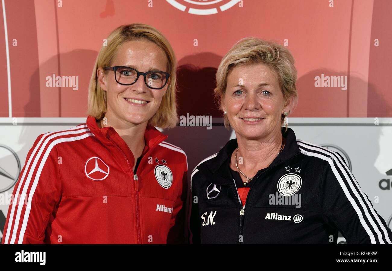 Germany's head coach Silvia Neid (R) and new captain Saskia Bartusiak ...