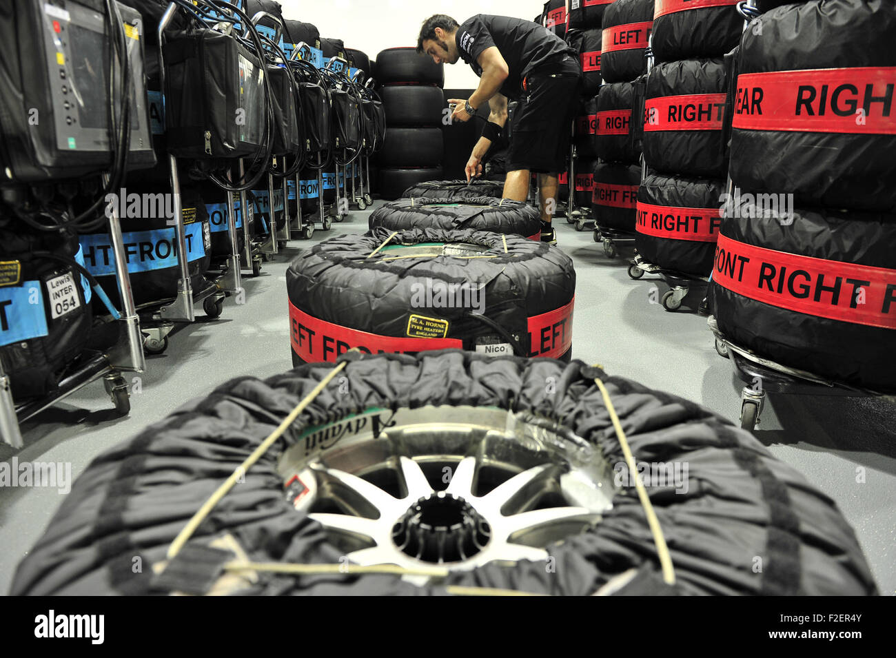 Singapore. 17th Sep, 2015. A technician checks tires at Singapore's F1 ...