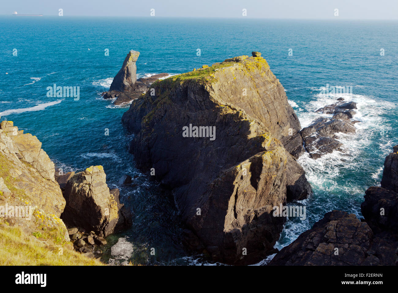The dramatic coastal scenery on the SW Coast Path at Bumble Rock on the ...