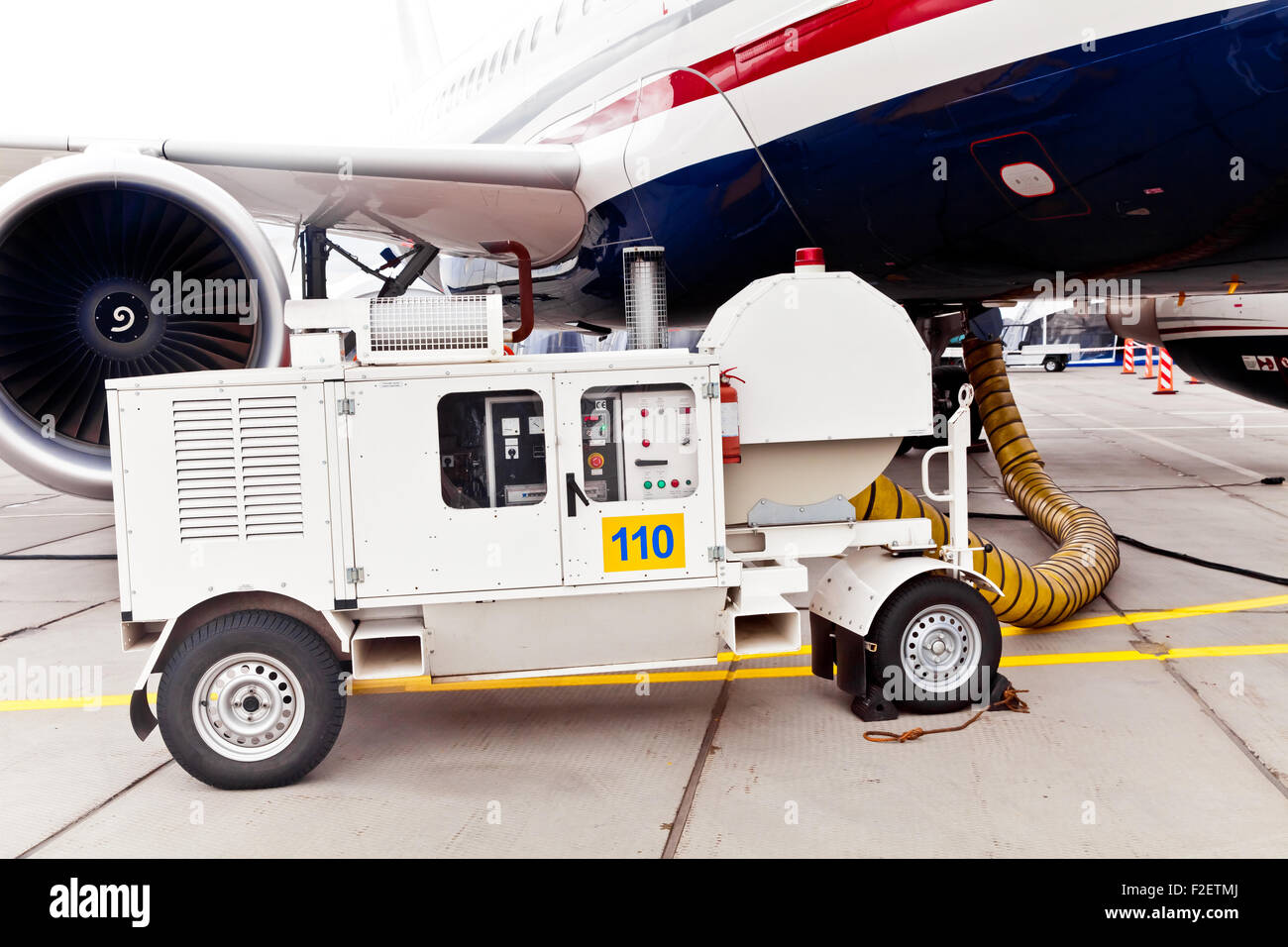 Refueling the airplane in airport and preparing for flight Stock Photo ...