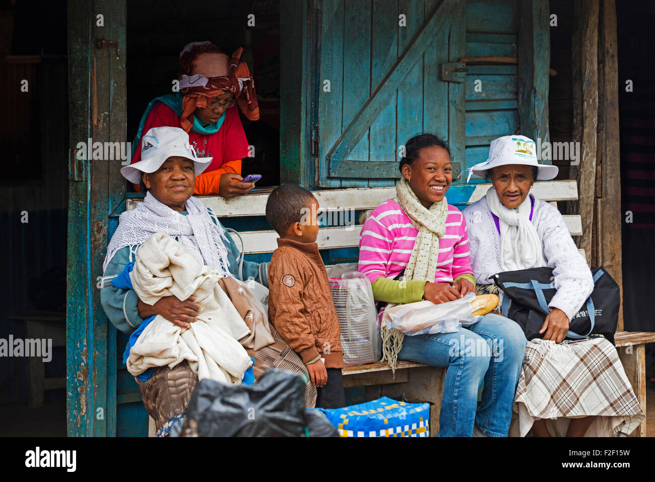 Malagasy family waiting at taxi brousse station / parcage in Manakara ...