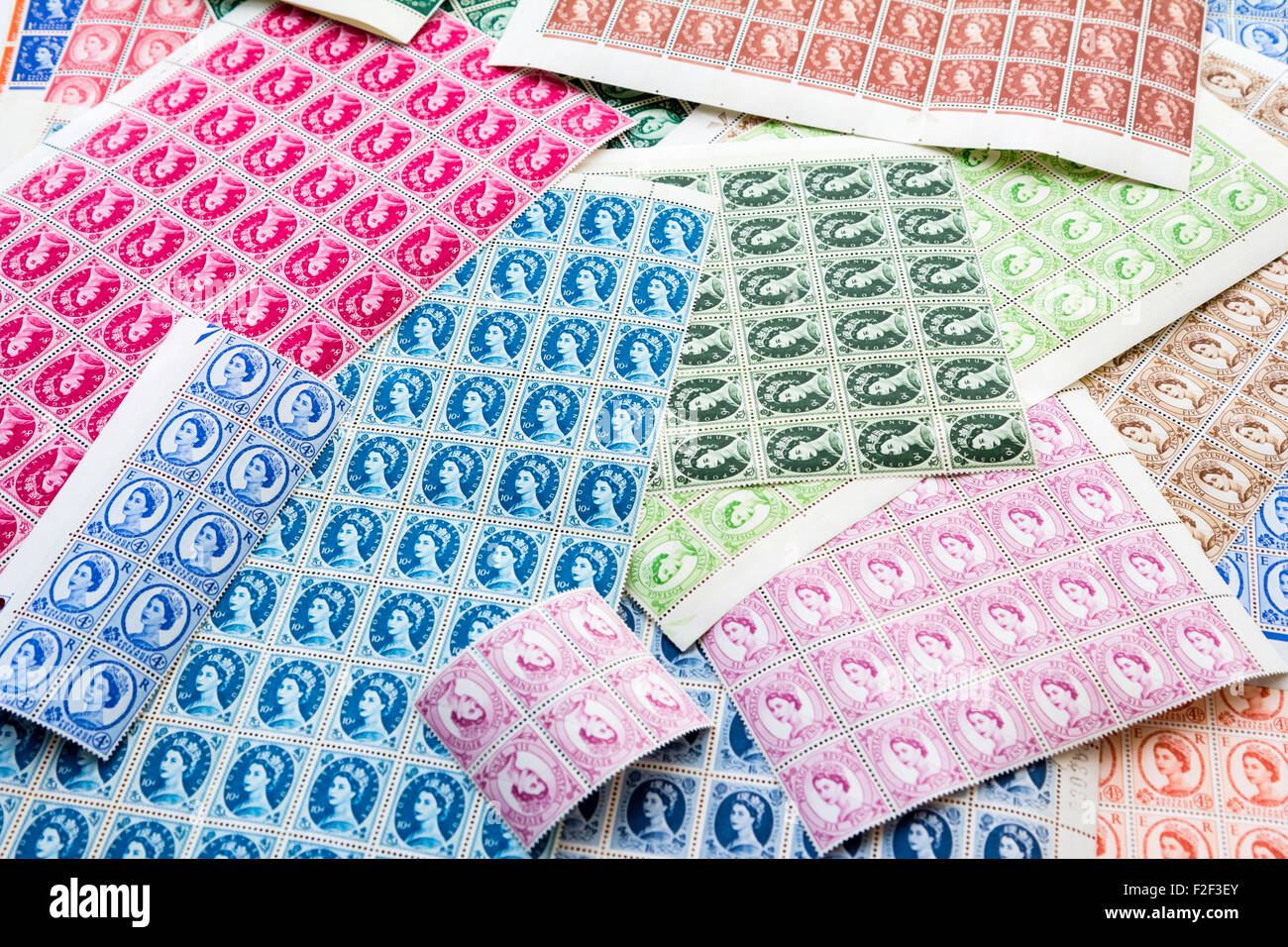 Sheets of British Wilding definitive stamps laying scattered on top of ...