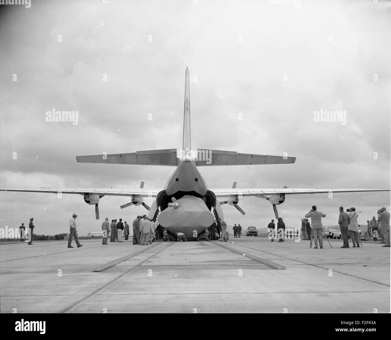 This image captures the loading of an Atlas vehicle onto a C-133 ...