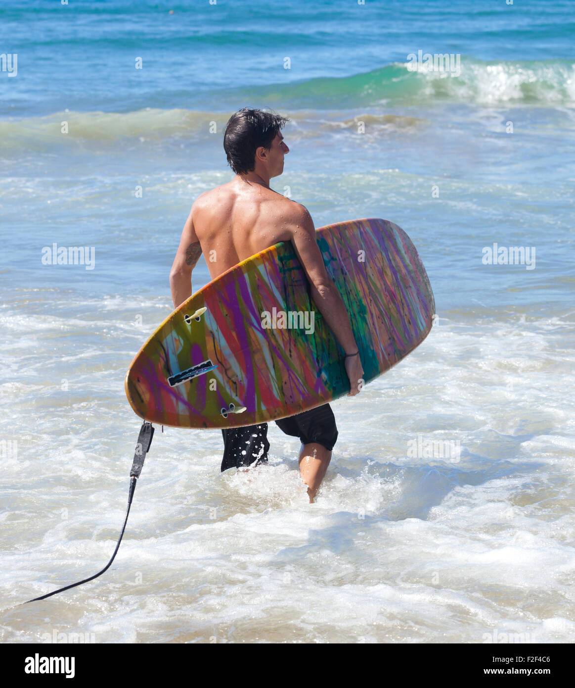 Portrait of Surfer with longboard on the beach Stock Photo - Alamy