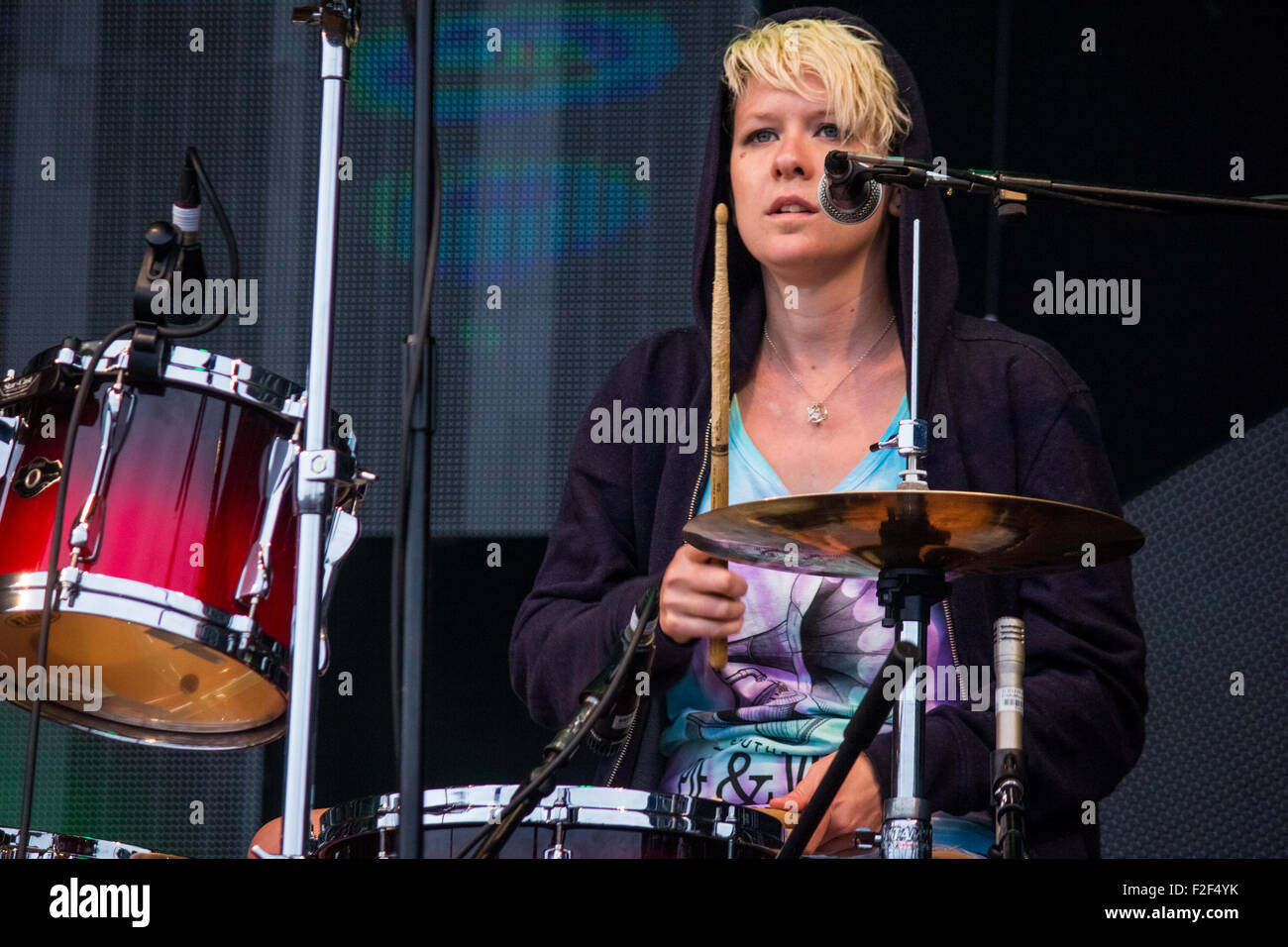 Cat Myers of Honeyblood drumming at Victorious Festival 2015 with hood ...