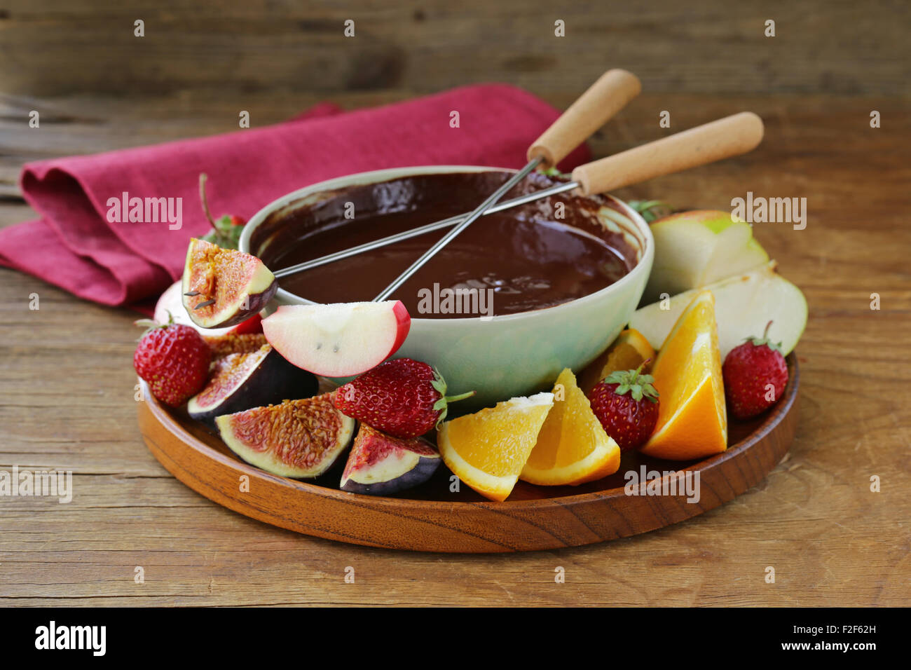 chocolate fondue with various fruits - easy and delicious dessert Stock ...
