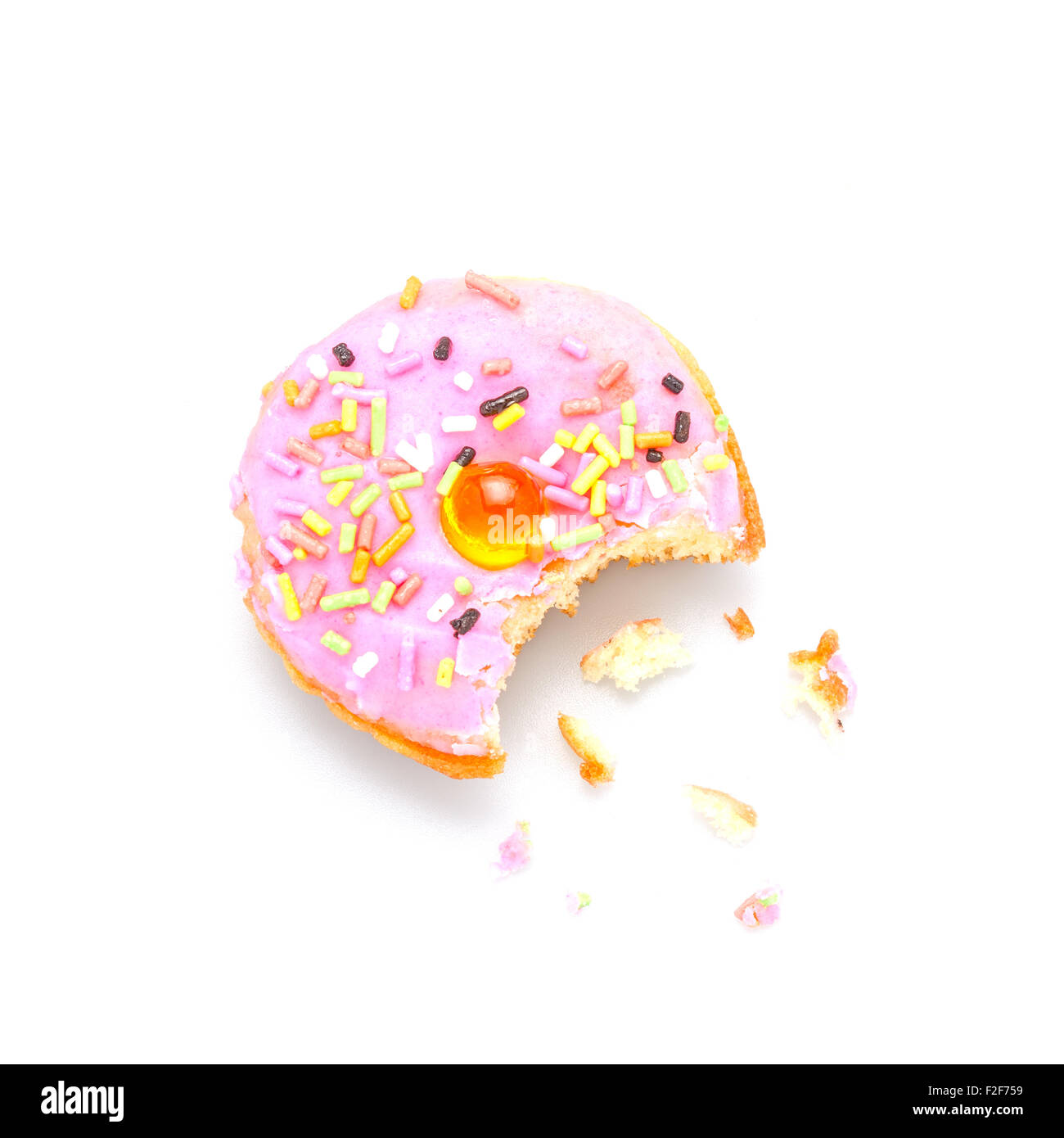 The bitten Donut with sprinkles on white background Stock Photo - Alamy