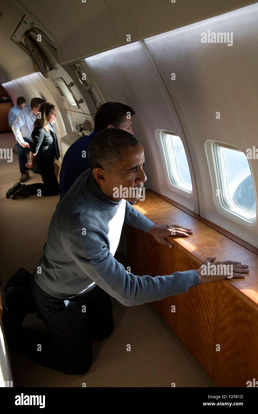 U.S. President Barack Obama alongside Senior Advisor Brian Deese looks ...