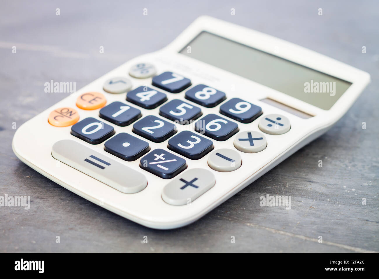 Calculator on grey background, stock photo Stock Photo - Alamy