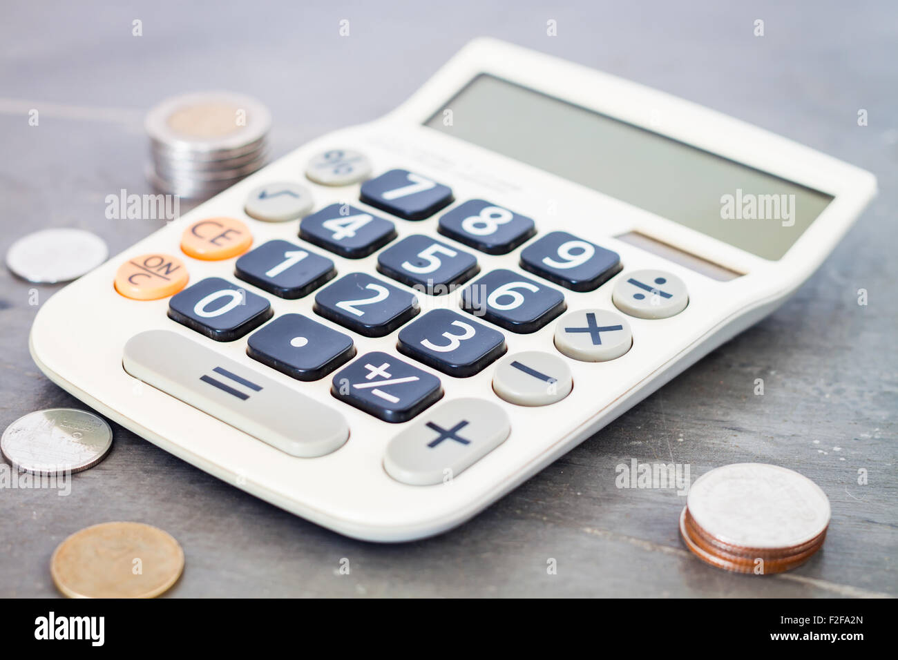 Calculator with money on grey background, stock photo Stock Photo - Alamy
