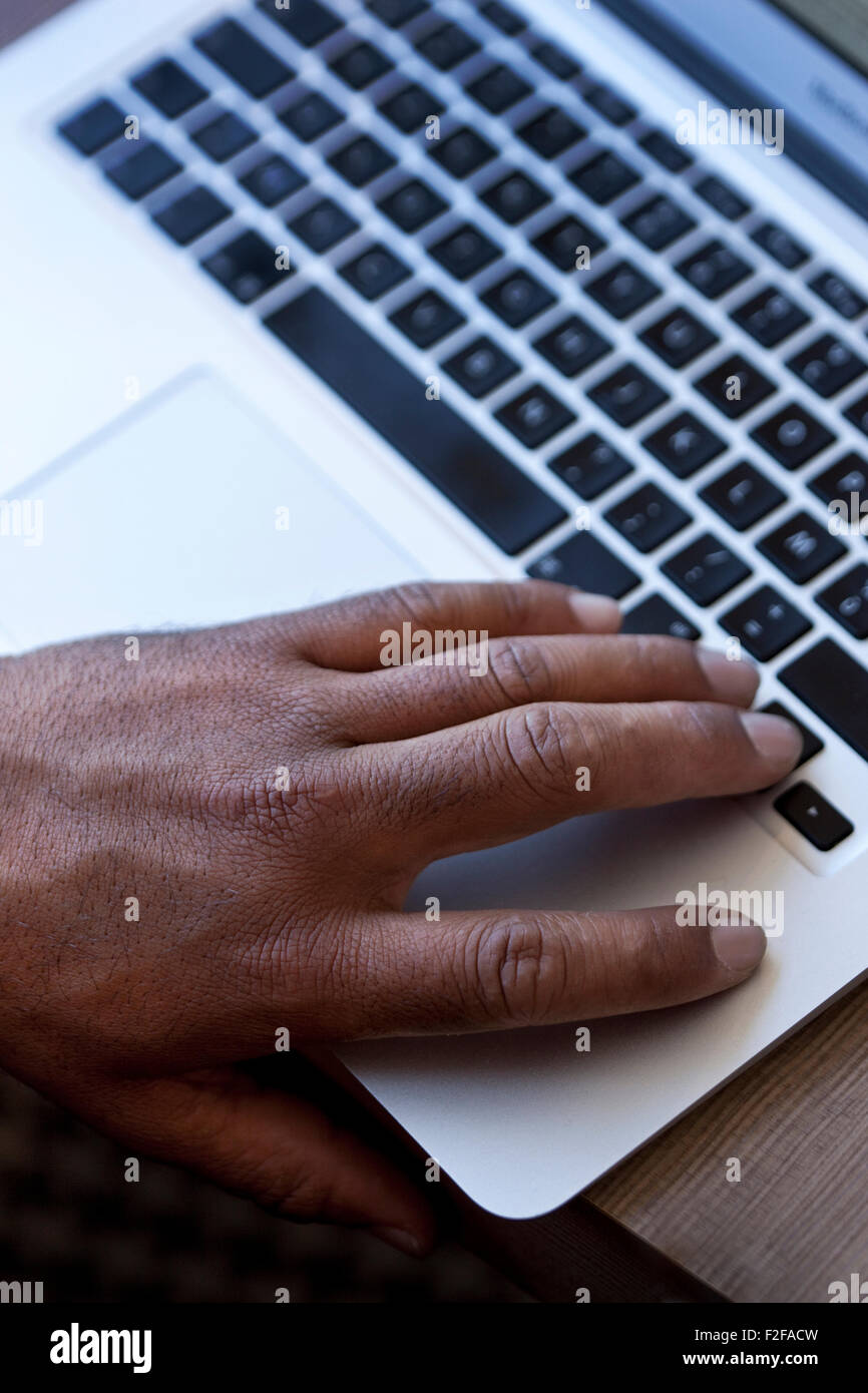 Hand of a man touching a computer keyboard Stock Photo - Alamy