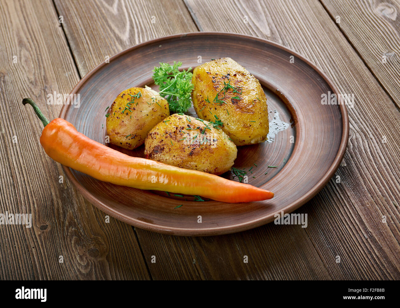 Imthawoma - Libyan potatoes in tomato sauce and spices Stock Photo - Alamy