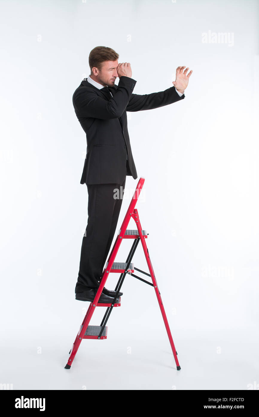 Using ladder hi-res stock photography and images - Alamy