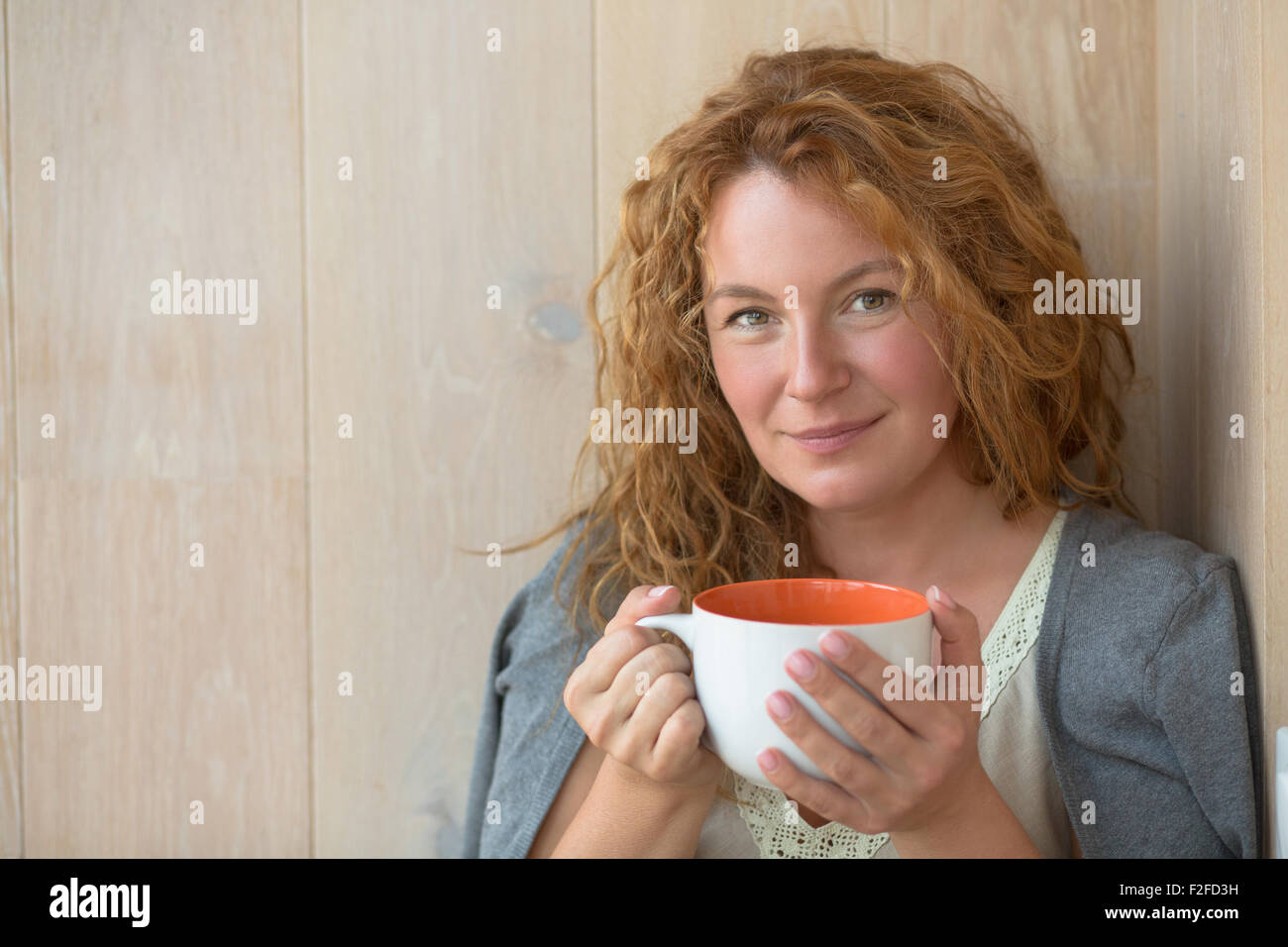 Middle-aged woman with a cup of tea Stock Photo - Alamy