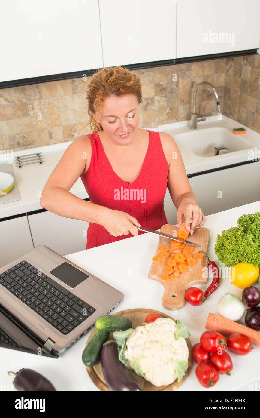 Housewife cooking in the kitchen Stock Photo - Alamy