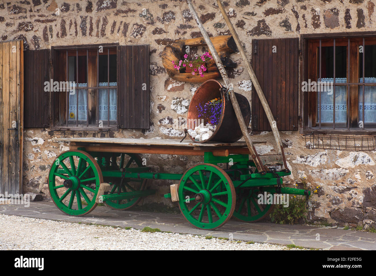 View of old cart next to the house Stock Photo - Alamy