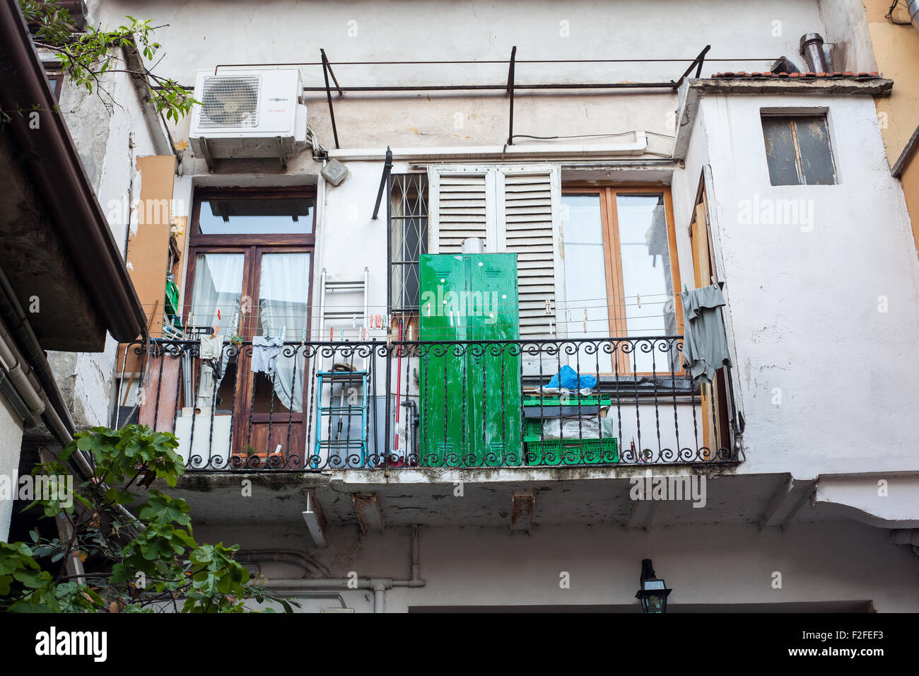 View of a old balcony in a poor house in Milan Stock Photo - Alamy