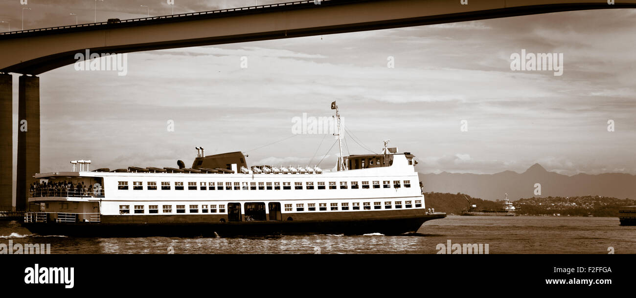 Barca Rio-Niteroi ferry boat passing through a bridge on Baia de ...