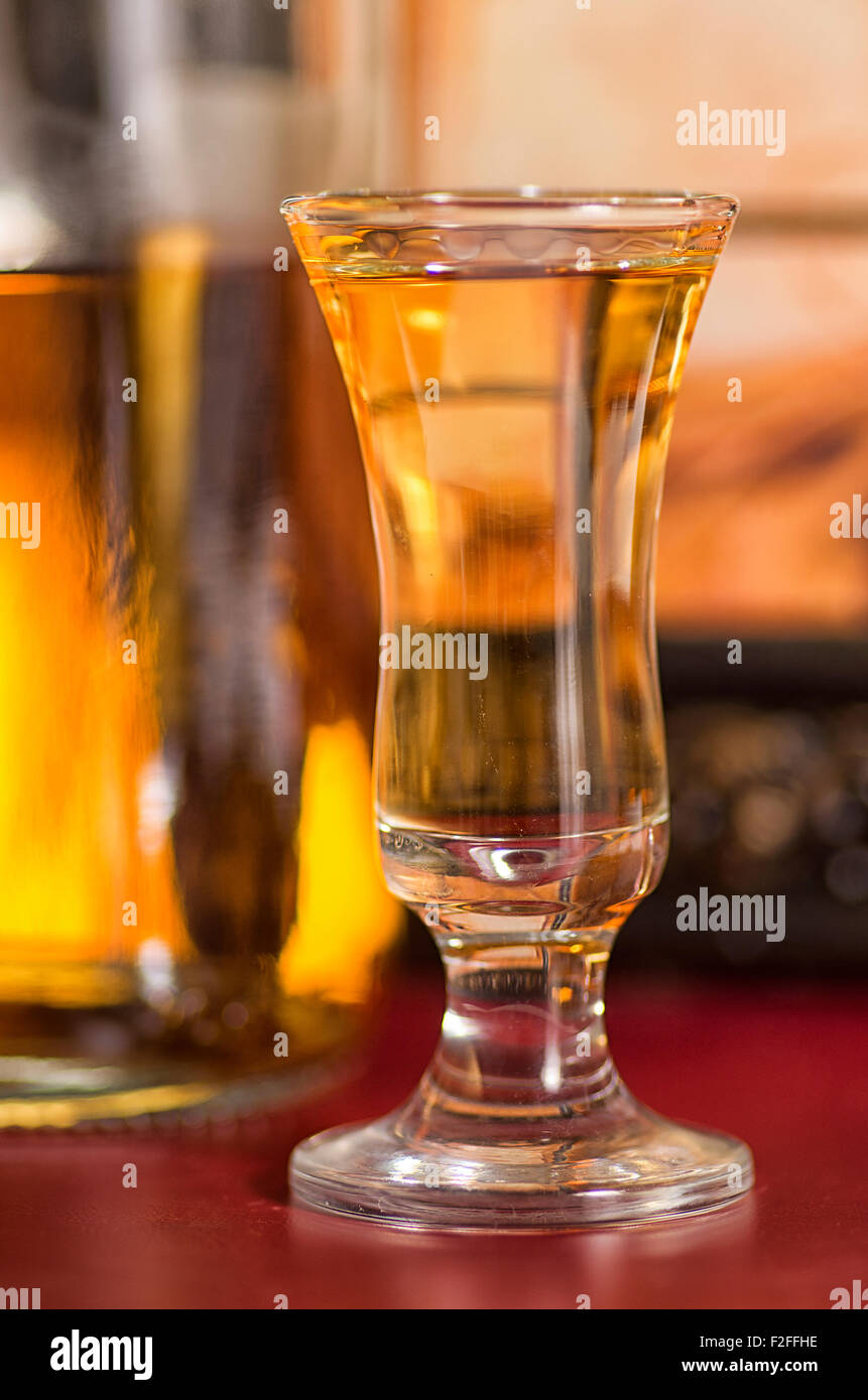 Rum poured into a glass Stock Photo - Alamy