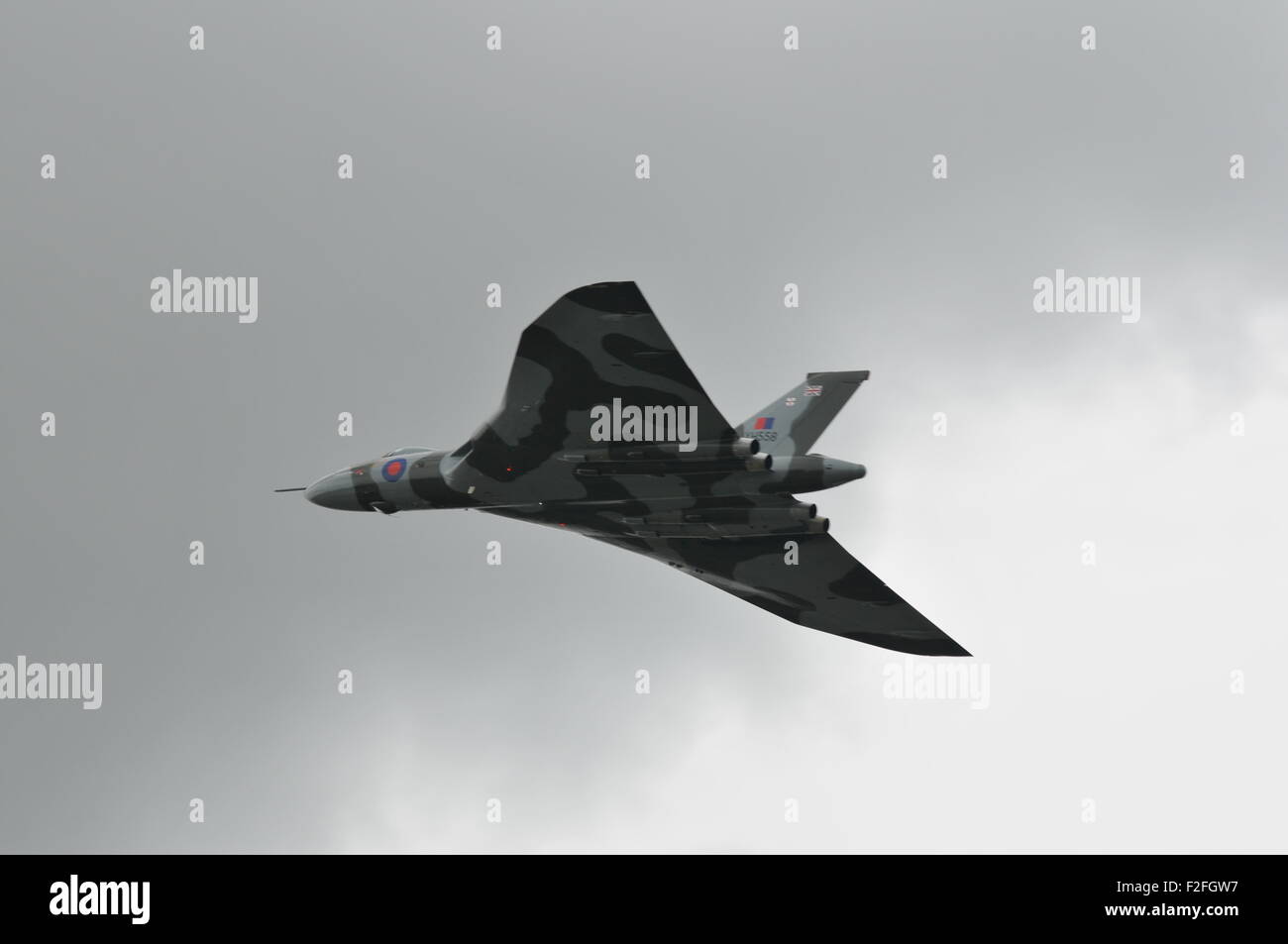 Avro Vulcan XH558 flying from right to left, dark cloudy sky Stock ...