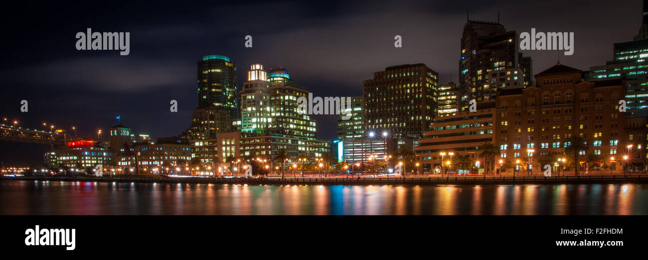 Buildings at the waterfront lit up at night, San Francisco, California ...