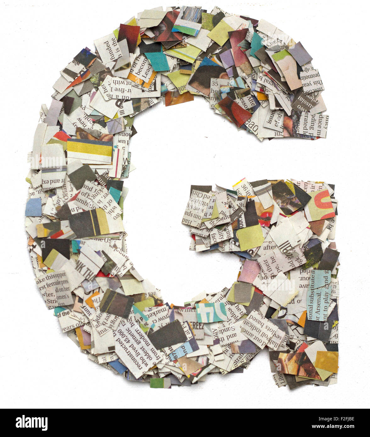 The letter G made from newspaper confetti Stock Photo - Alamy