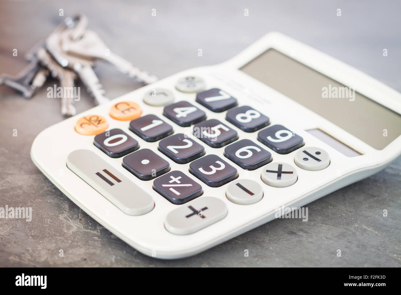 Calculator with keys on grey background, stock photo Stock Photo - Alamy